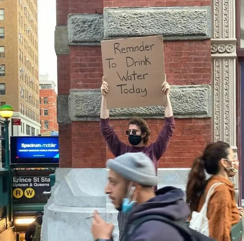 30 Hilarious Pictures Of A Man Protesting Obscure Things