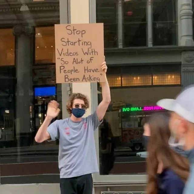30 Hilarious Pictures Of A Man Protesting Obscure Things